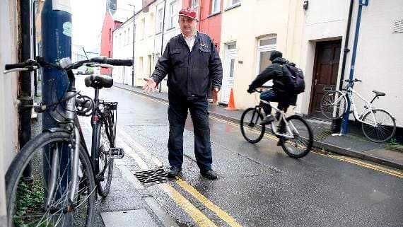 Find a solution to the town bike problem, such as racks and storage ...