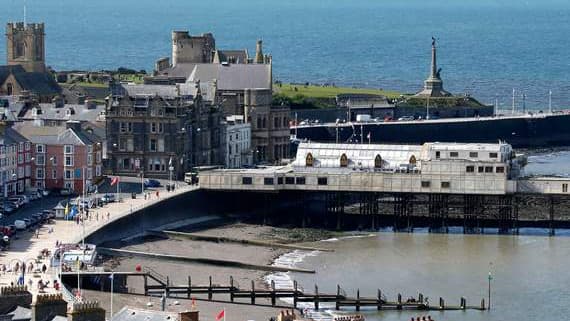 Woman doing 'remarkably well' after fall from Aberystwyth promenade ...