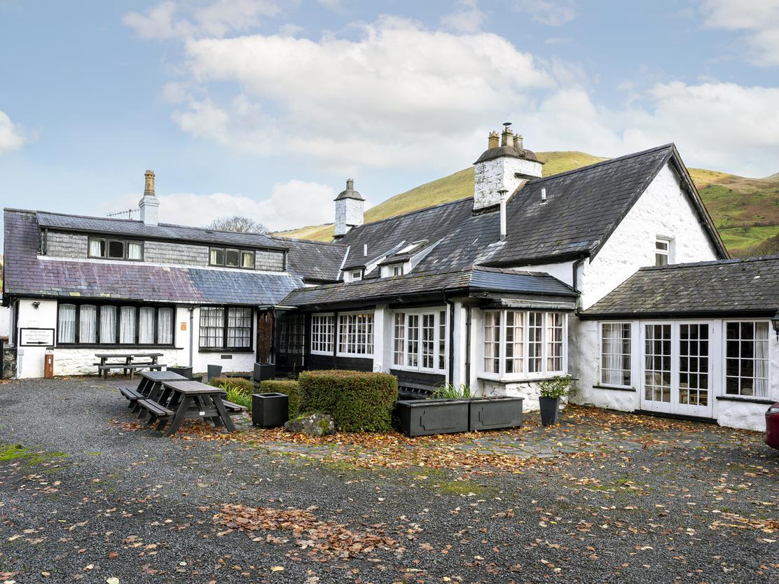 Tywyn historic hotel for sale sits at the base of a mountain in the ...