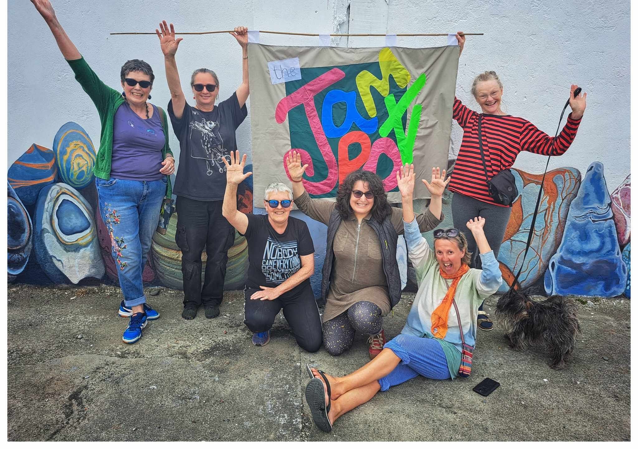 Borth volunteers transform "eyesore" concrete wall into work of art ...