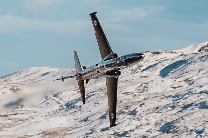 Jaw-dropping pictures show RAF airplanes zooming through a snowy Mach ...